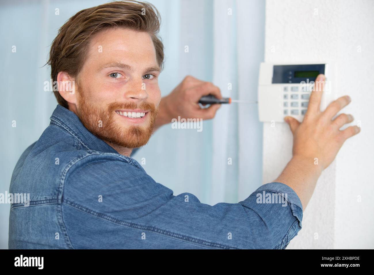 man installing ip wireless cctv camera Stock Photo - Alamy