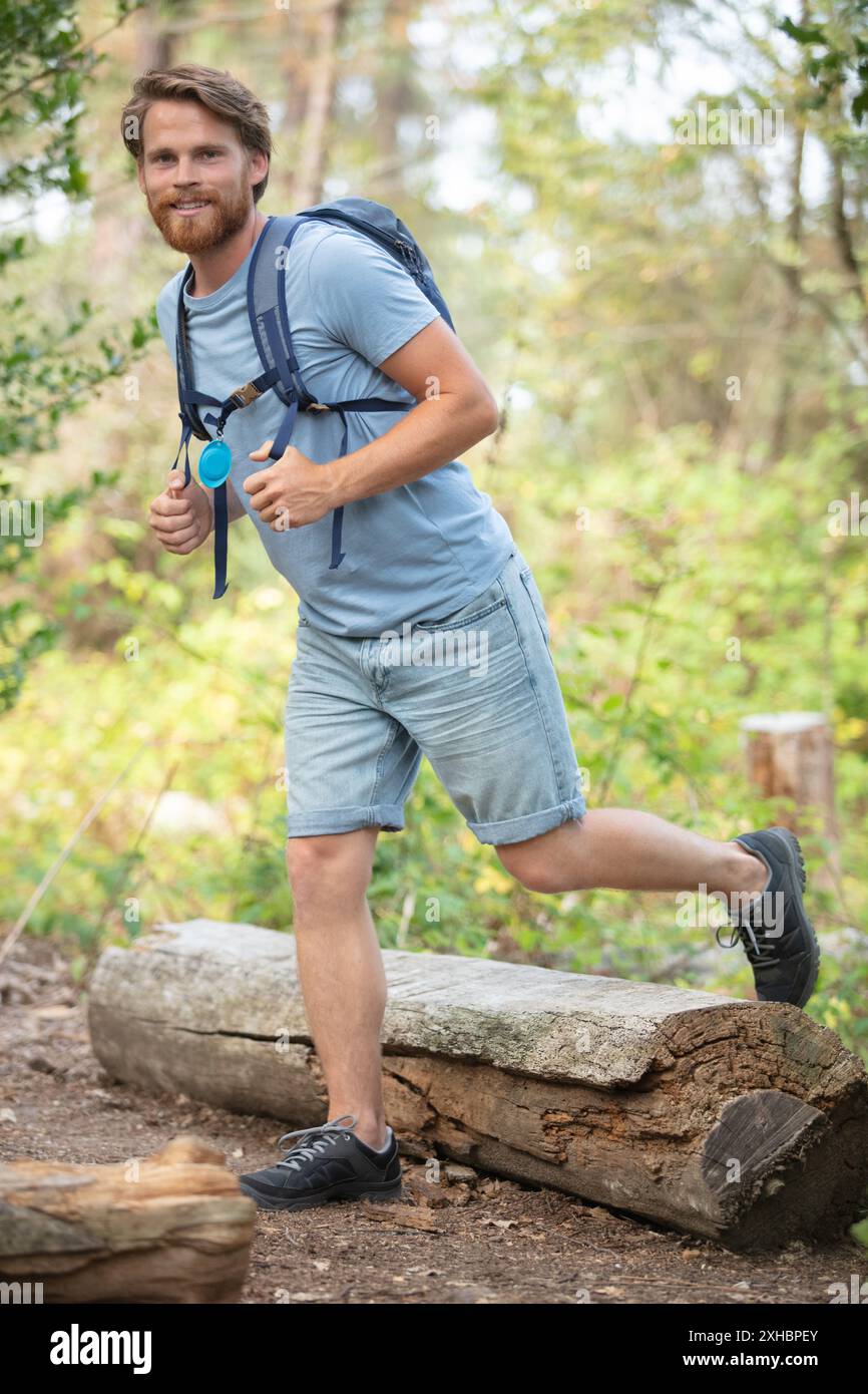young man walking in nature and exploring a wild forest Stock Photo - Alamy