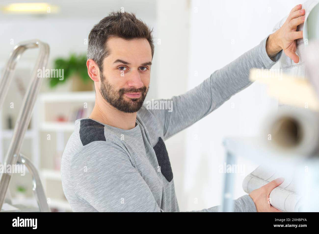 man fitting some new kitchen units Stock Photo - Alamy