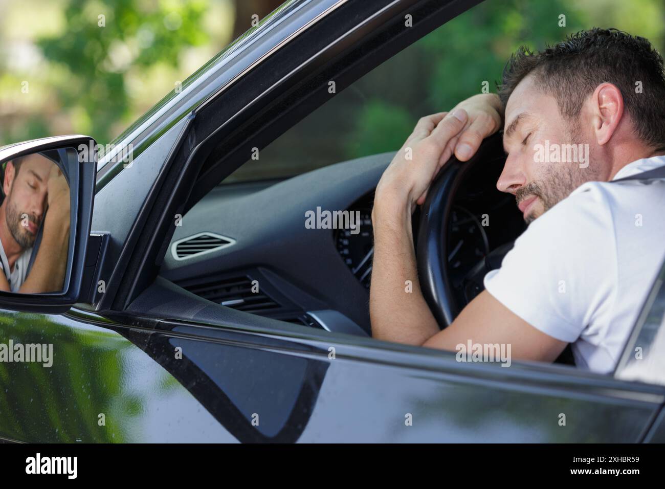 Young man asleep car hi-res stock photography and images - Alamy