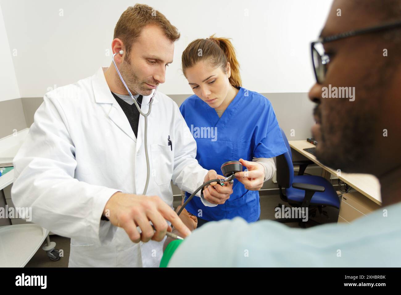 young doctor learning to messure blood-pressure Stock Photo - Alamy