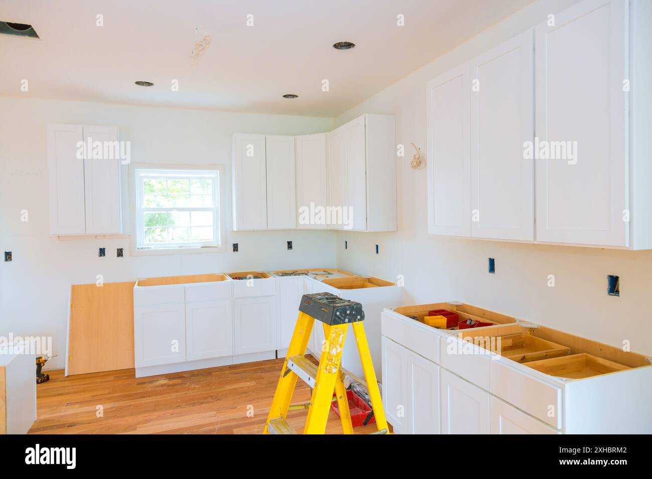 Custom kitchen cabinets are installed montage in kitchen during ...