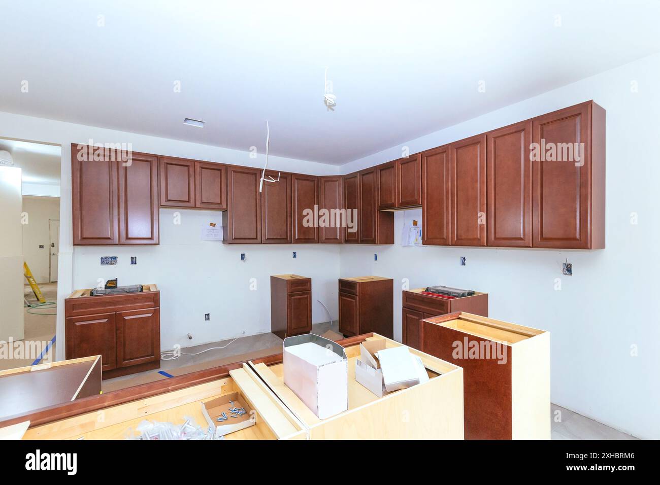 Assembling new custom kitchen cabinet as part of home improvement ...