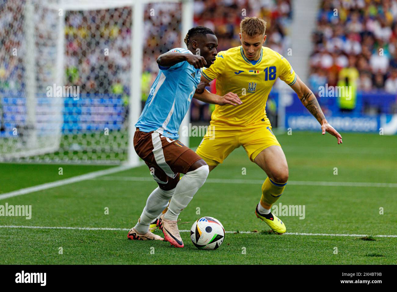 Jeremy Doku, Volodymyr Brazhko seen during UEFA Euro 2024 game between ...