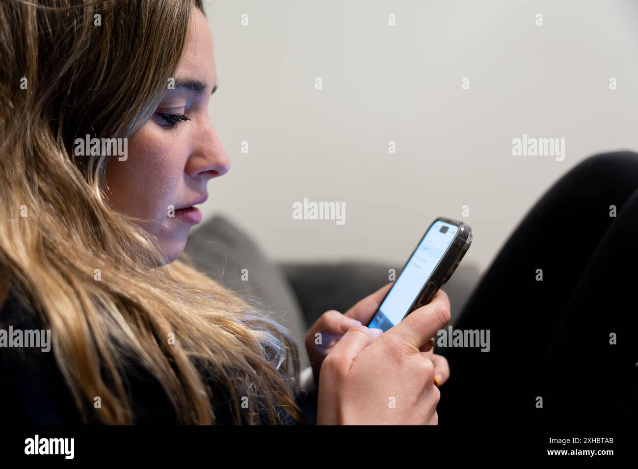 Closeup of a girl staring at the mobile screen. Concept of addiction ...