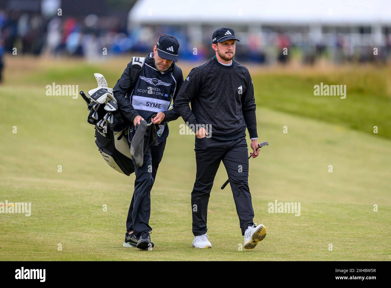 Connor Syme and his caddie Ryan McGuigan on the 1st hole during day ...