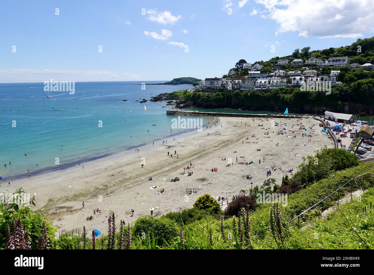 Looe, Cornwall, UK. 13th July, 2024. Families enjoying sunny Looe beach ...