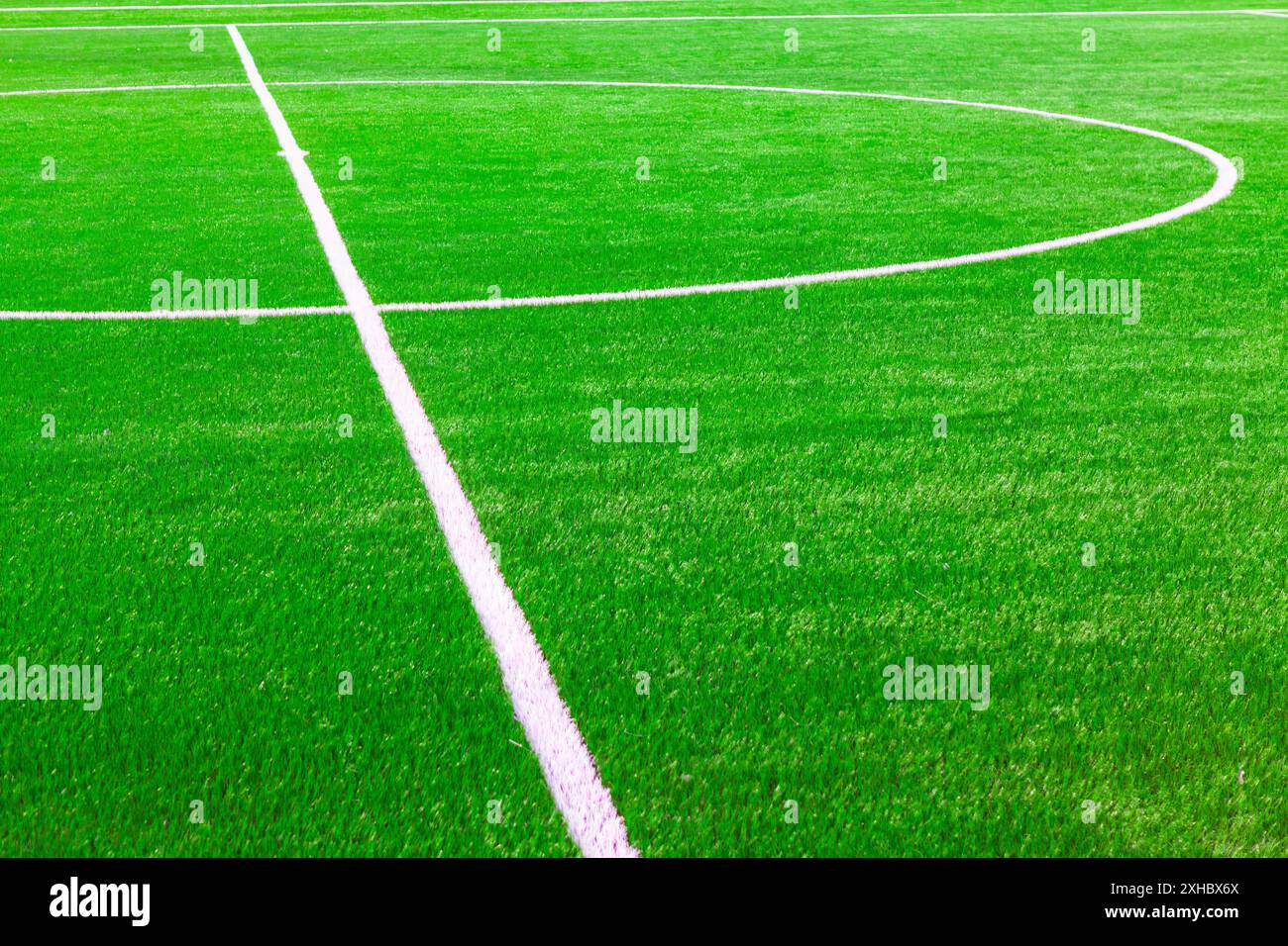 Green soccer field with white line in the middle, ready for a match ...
