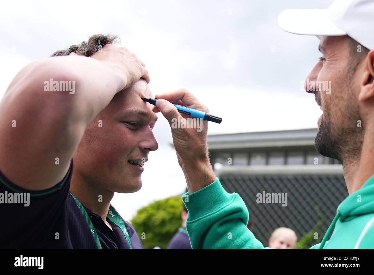 Novak Djokovic signs fans forehead as he makes his way to training on ...