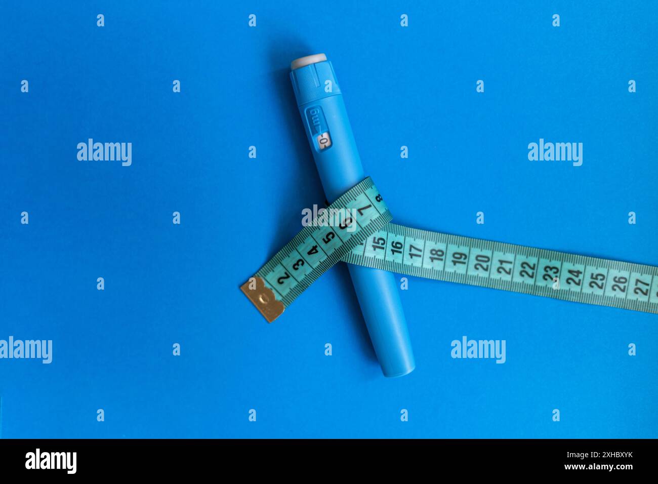 Blue drug injector pen Ozempic anti diabetes is wrapped with a ...