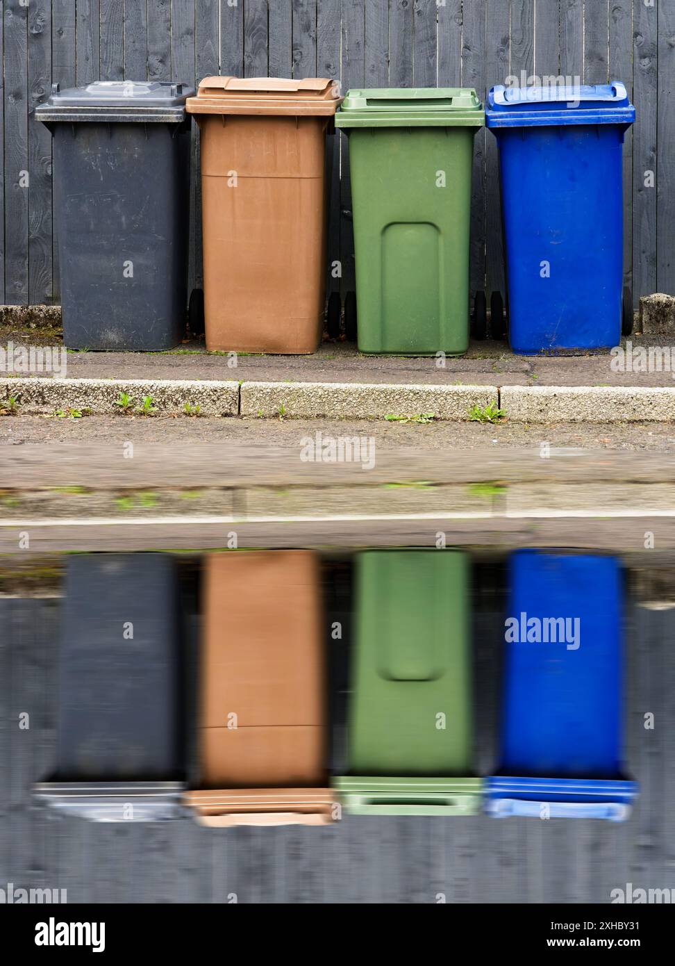 Wheelie bins in row for refuge collection outside council residential ...