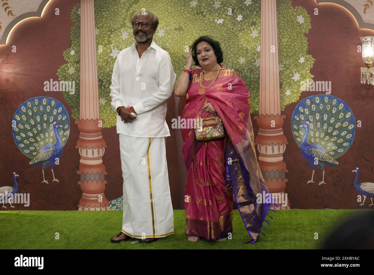Indian actor Rajinikanth and his wife Latha Rajinikanth pose for a ...