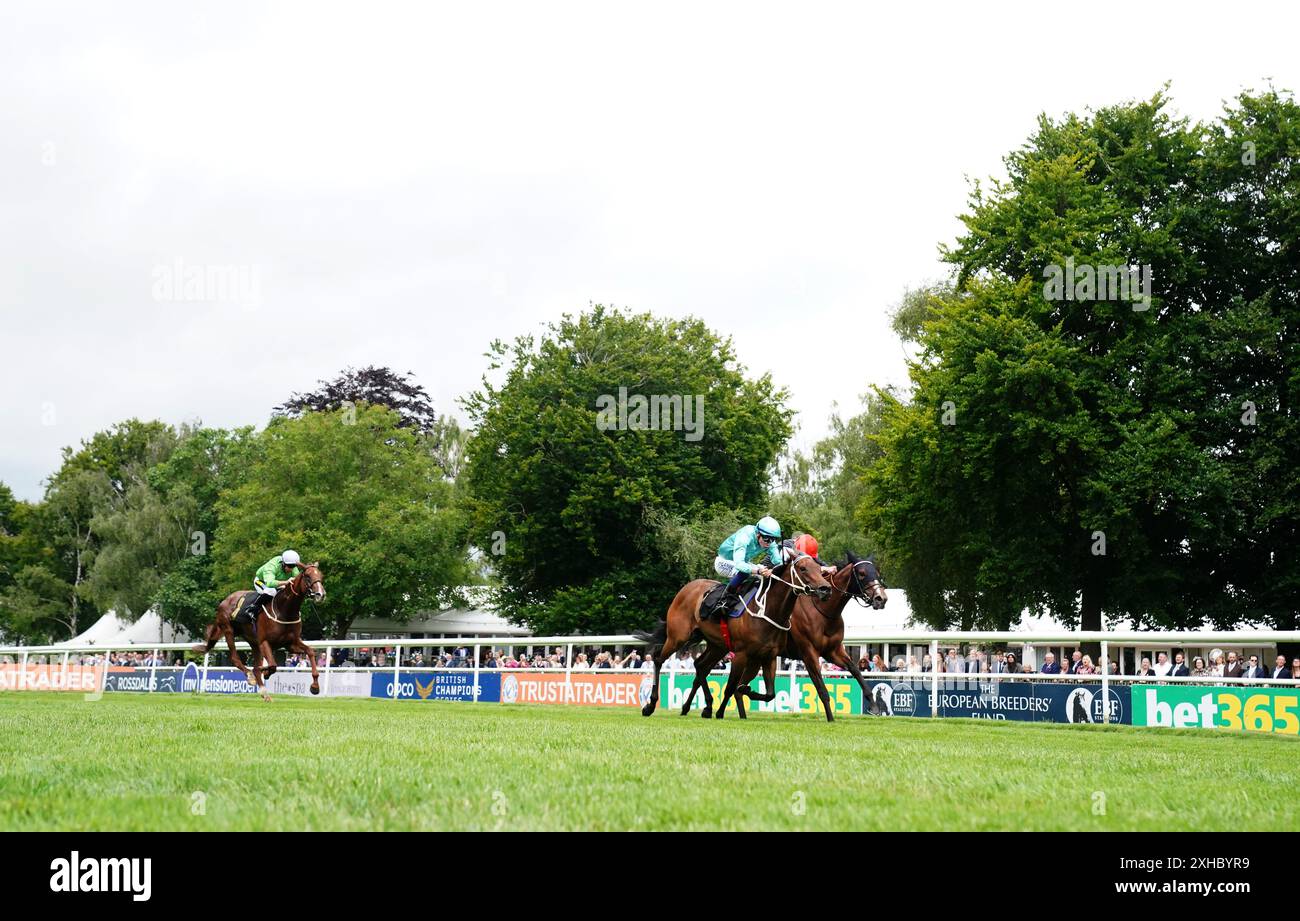 Asian Daze ridden by Billy Loughnane (centre) coming home to win the ...