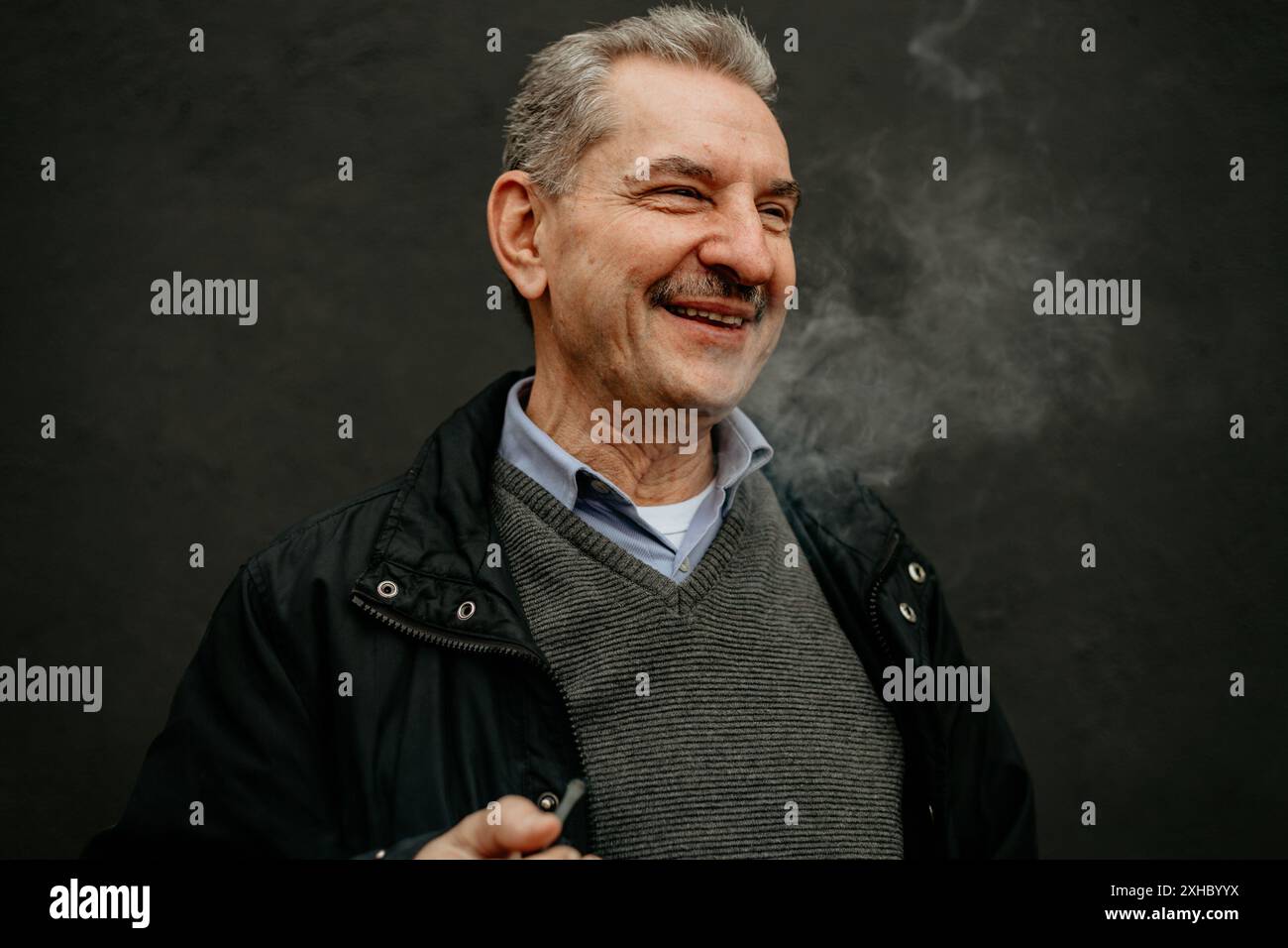 Elderly man mustache smokes cigarette hi-res stock photography and ...