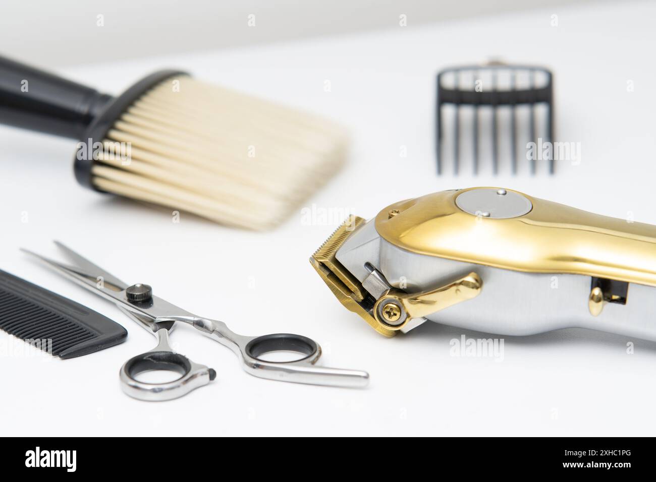 close up view of barber tools on a white table, hairdresser equipment ...