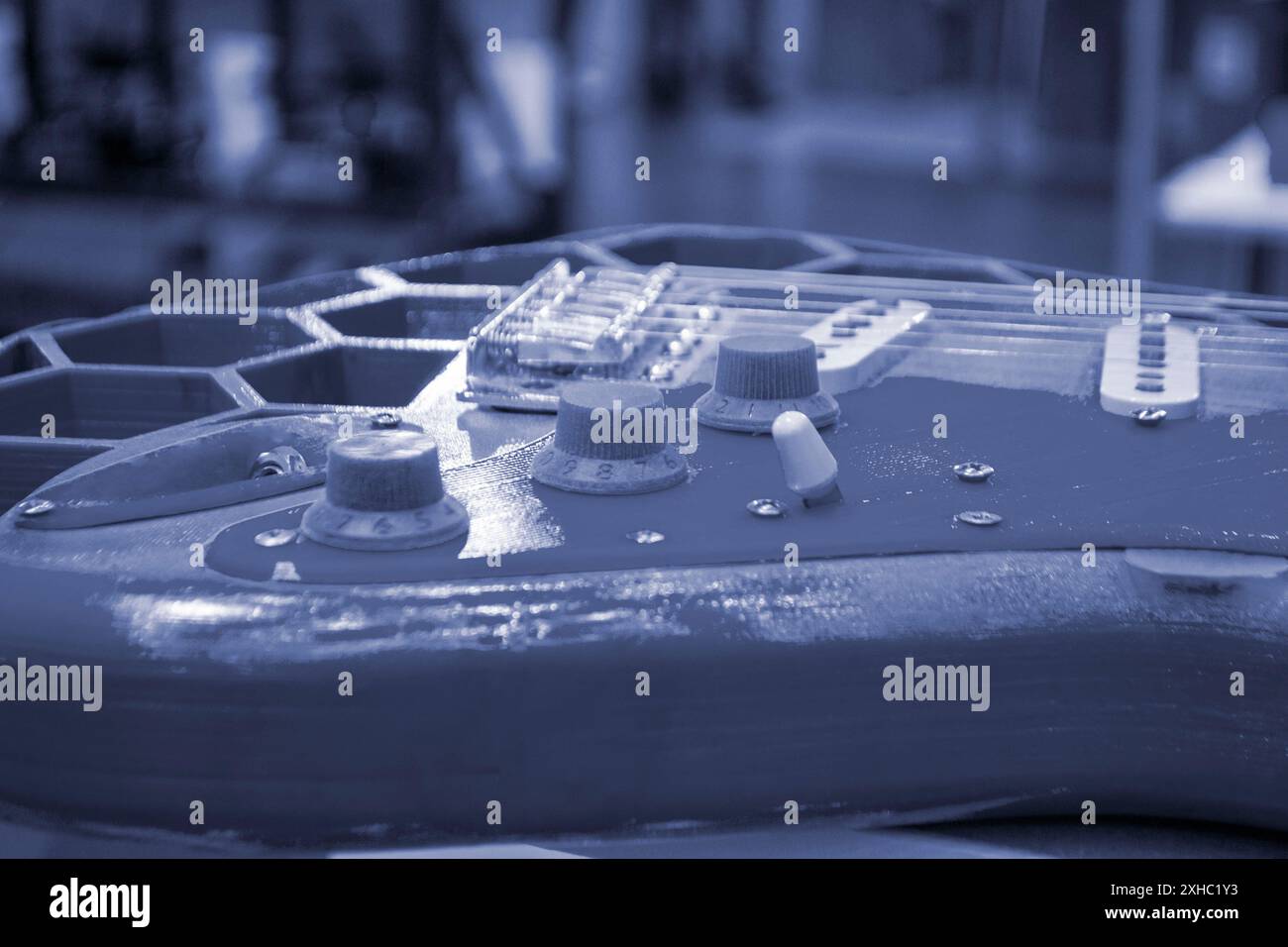 Musical instrument guitar 3D printed from molten plastic in yellow and ...