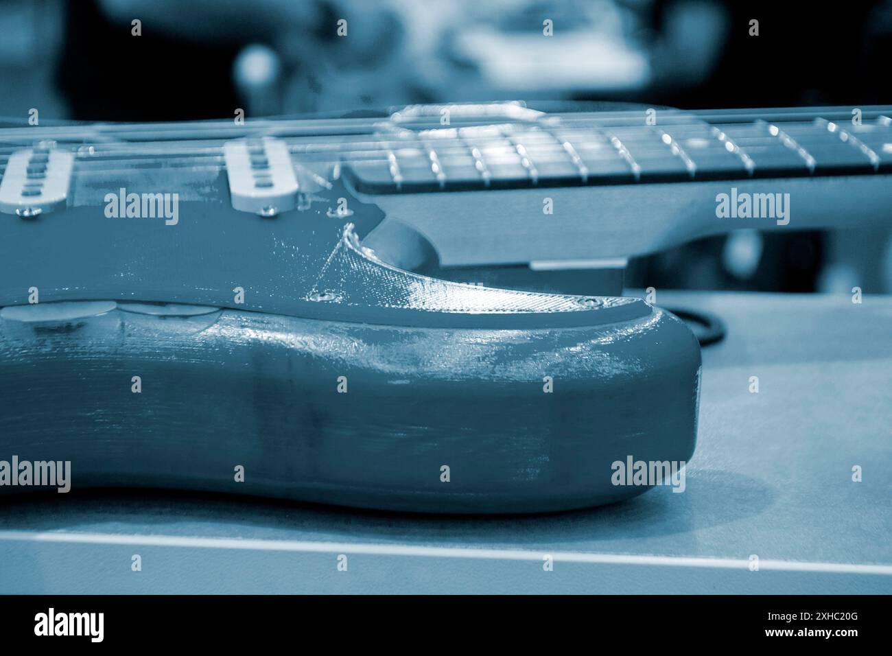 Musical instrument guitar 3D printed from molten plastic in yellow and ...