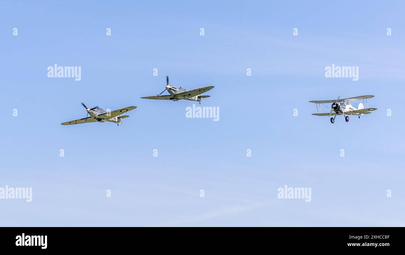 1938 Gloster Gladiator, 1941 Hawker Sea Hurricane 1b & Supermarine Spitfire Mk VC, airborne at ...