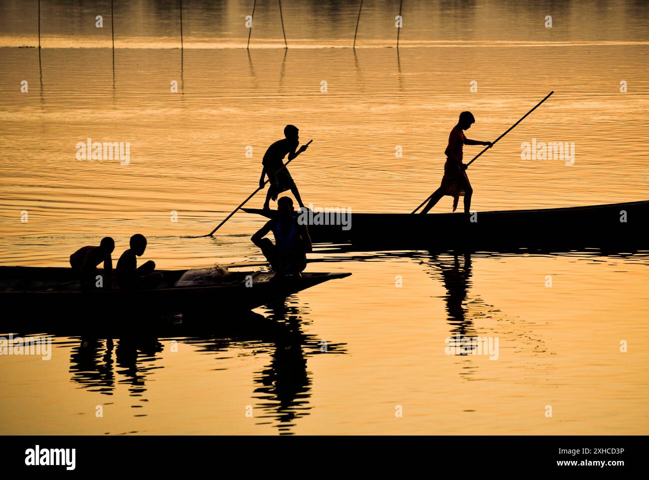 Fishermen fishing in Beki river during sunset, in Barpeta district of ...
