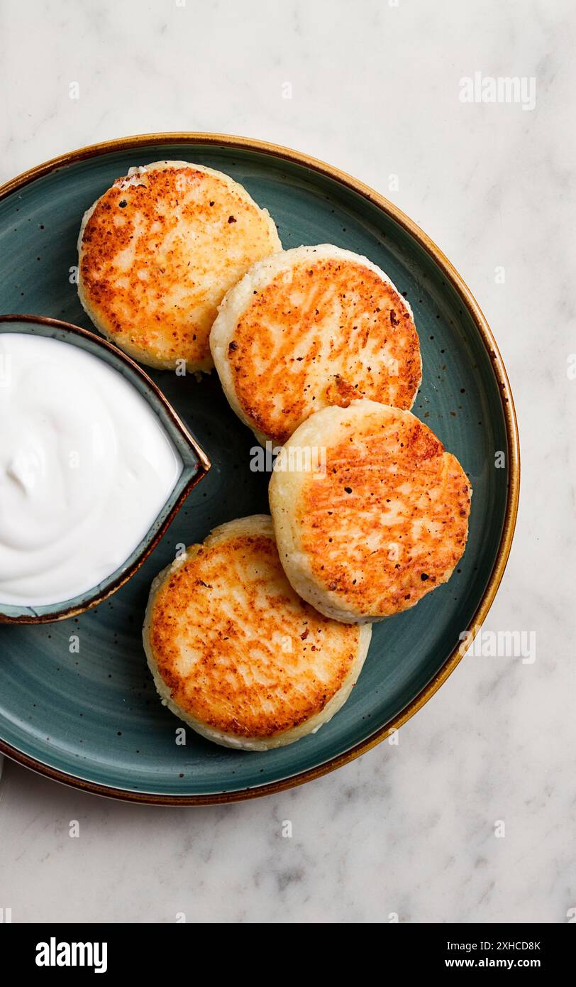 Fried, Cottage cheese pancakes, with sour cream, Cheesecakes, on a ...