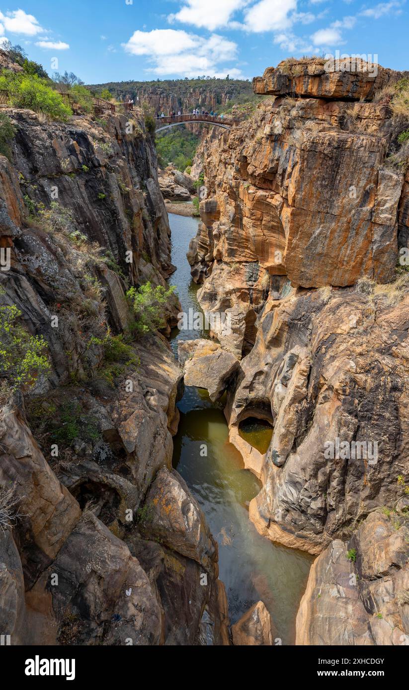 Bridge over a canyon with steep orange-coloured cliffs and the Blyde ...