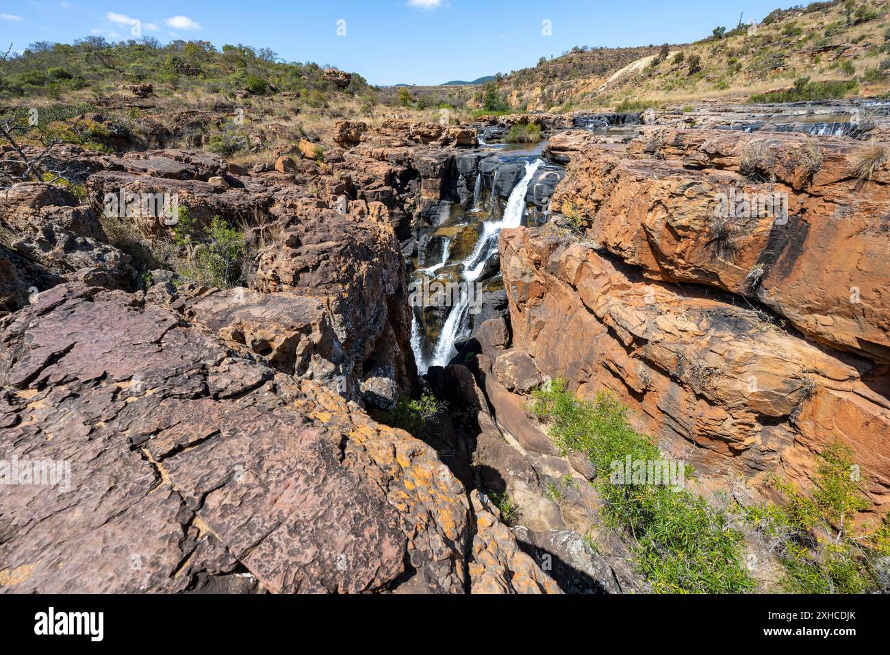 Waterfalls between orange-coloured rocks on the Treur River, Bourke's ...