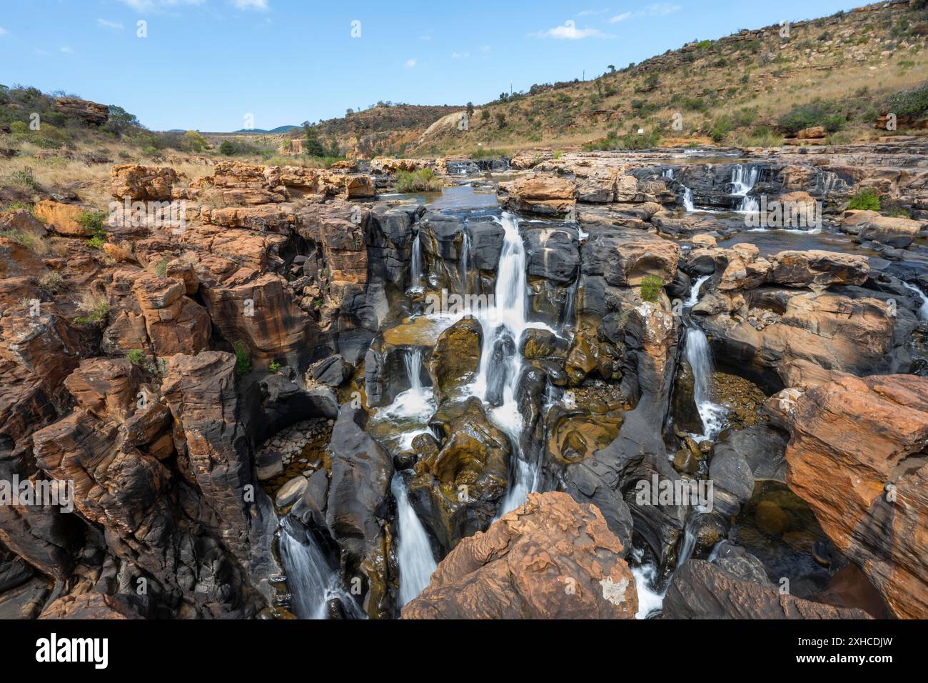 Waterfalls between orange-coloured rocks on the Treur River, Bourke's ...