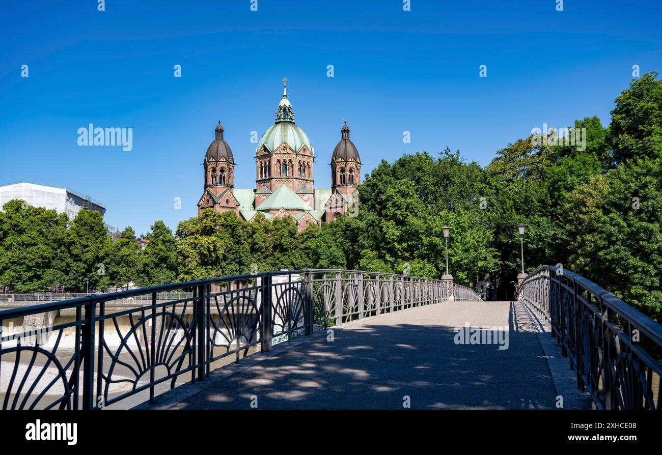 Bridge cable footbridge over the Isar, behind St Luke's Church, Munich ...