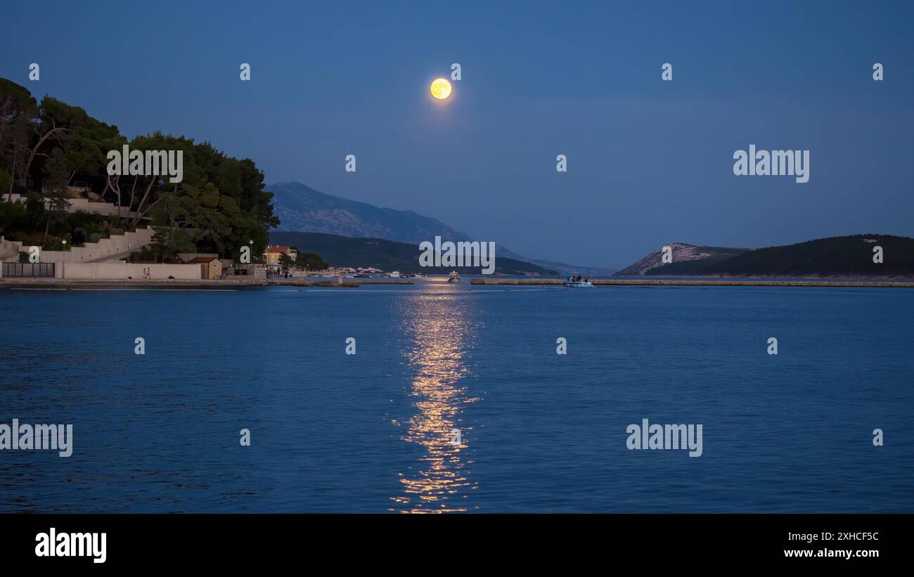 Full moon over tha bay of Banjol on island Rab in Croatia Stock Photo ...