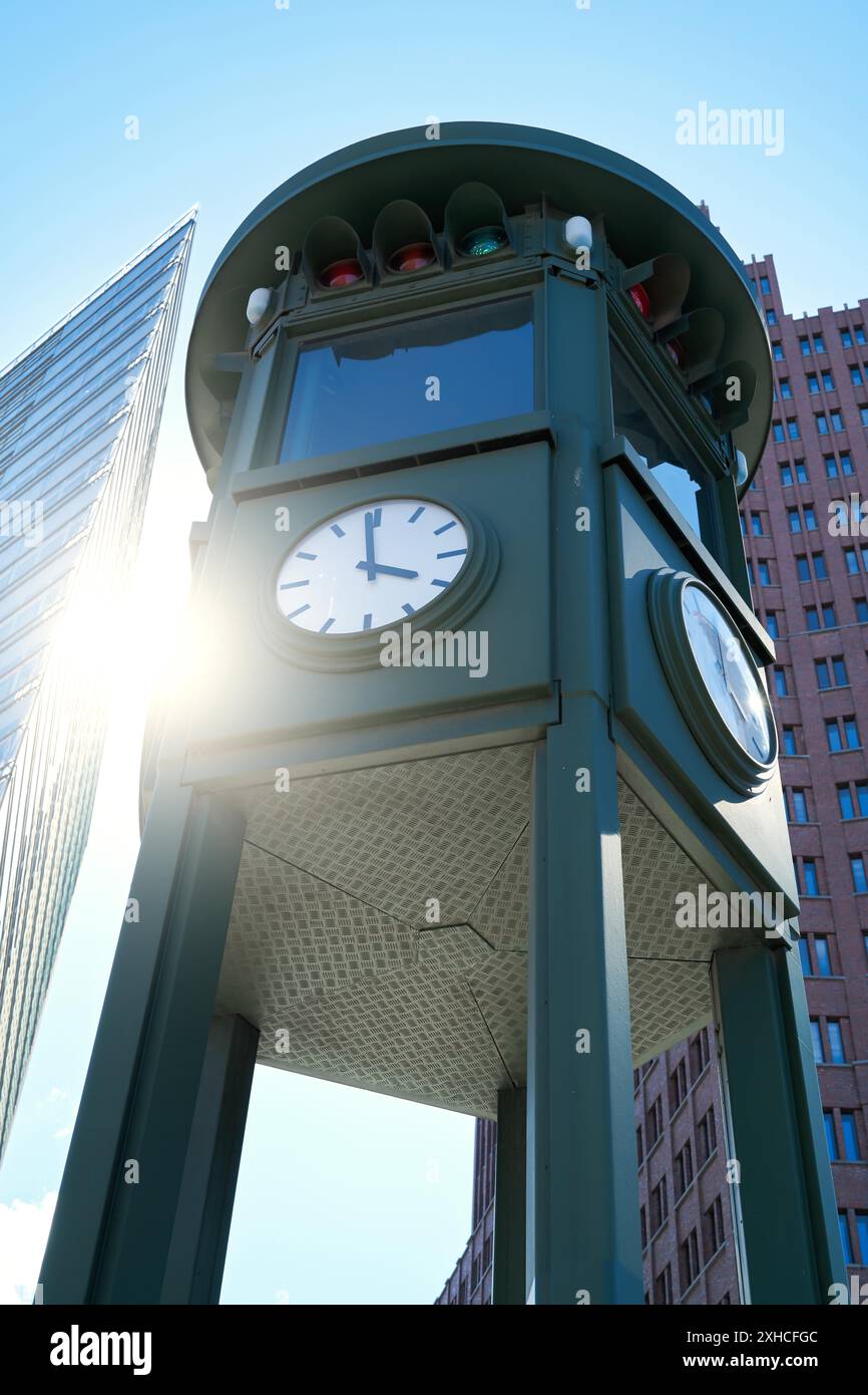 Clock at Potsdamer Platz in Berlin. It is also the first traffic light ...