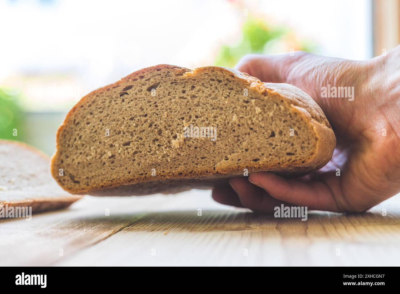 Baker holding sliced bread hi-res stock photography and images - Alamy