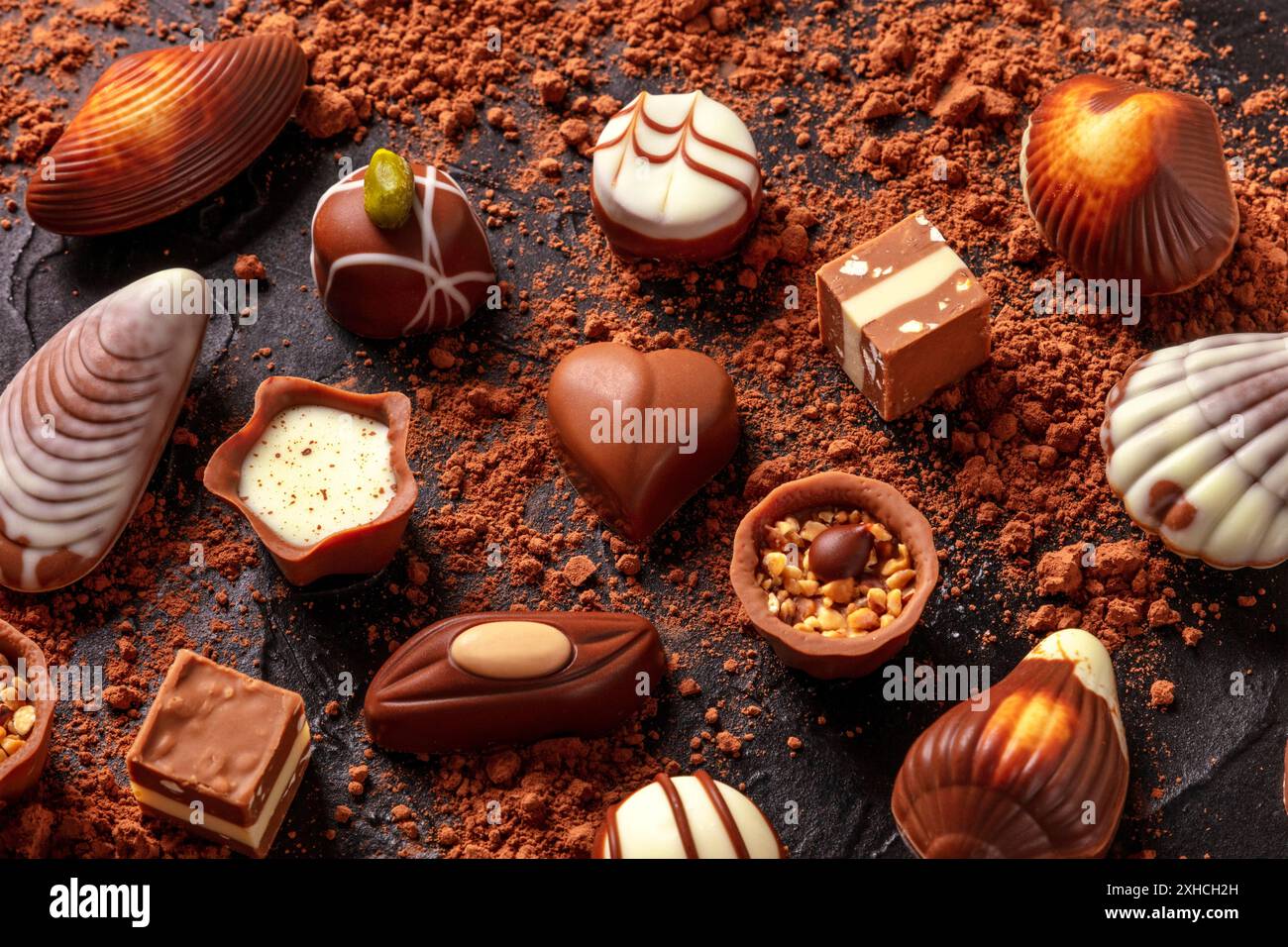 Belgian chocolate assortment, many different bonbons on a dark ...
