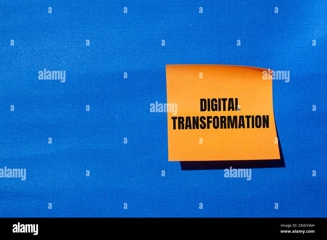Digital transformation message written on orange paper with blue ...