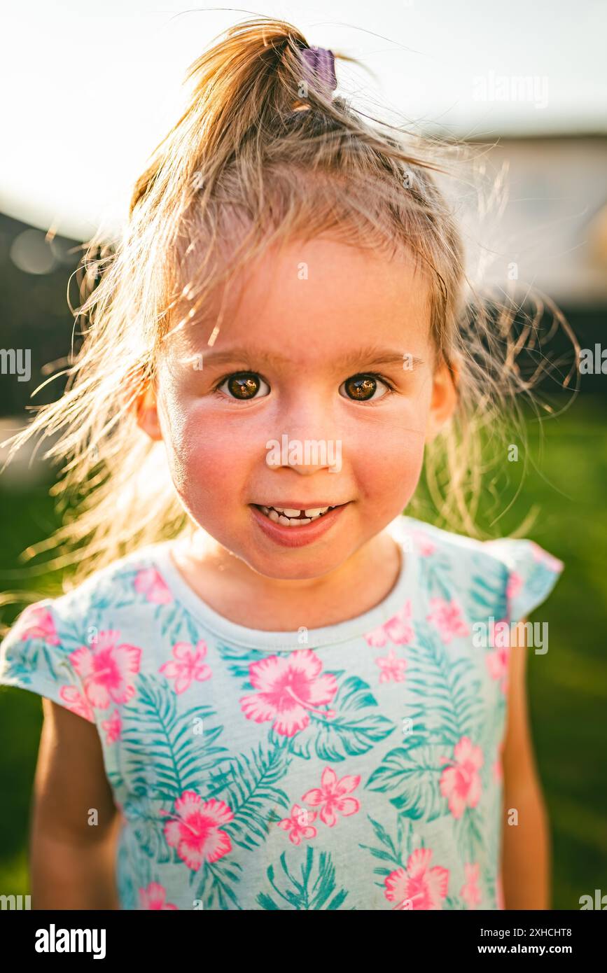 Beautiful baby girl portrait, green yard. 2-3 years old child in nature ...