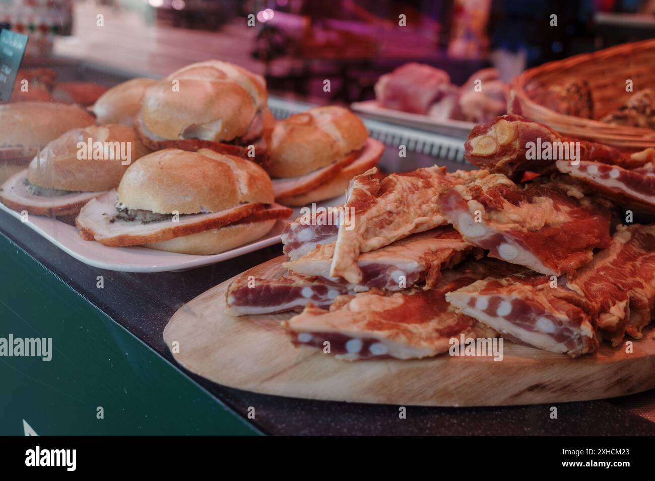 A close-up view of freshly made pork belly sandwiches and sliced pork ...