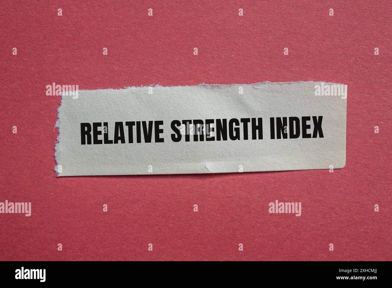 Relative strength index message written on ripped paper with red ...