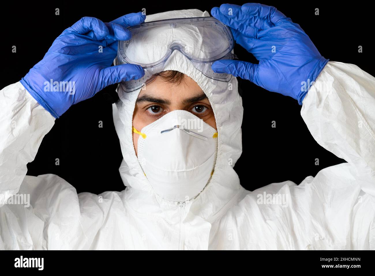 Covid-19 protective equipment. Portrait of Doctor or male nurse Wearing ...