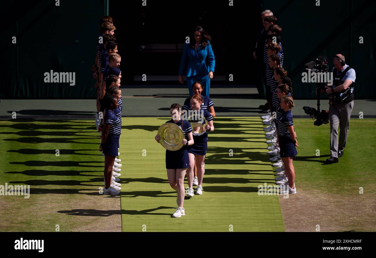 The ball kids carry the trophies out after the Ladies Singles final on ...