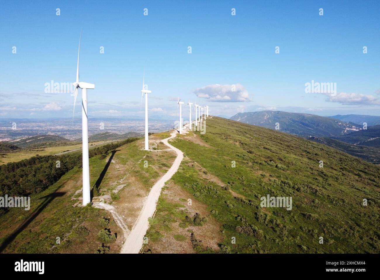 Aerial view of windmills farm for renewable energy production on ...
