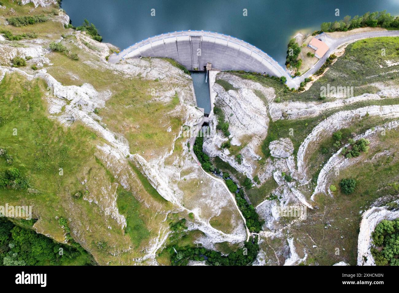 Aerial drone footage Water dam and reservoir lake, generating hydro electricity power renewable ...