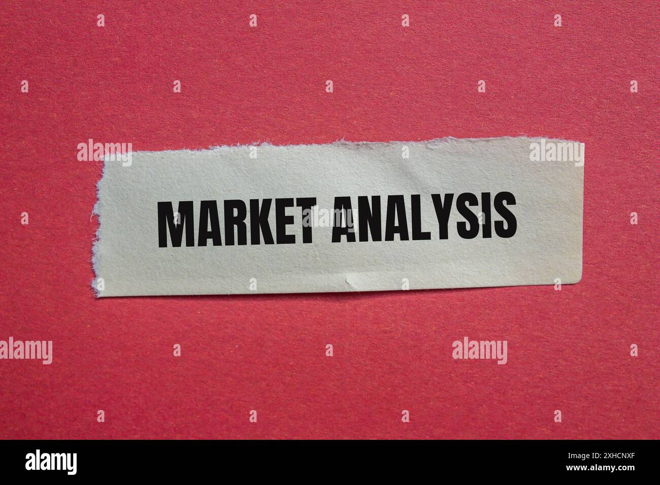 Market analysis message written on ripped paper with red background ...