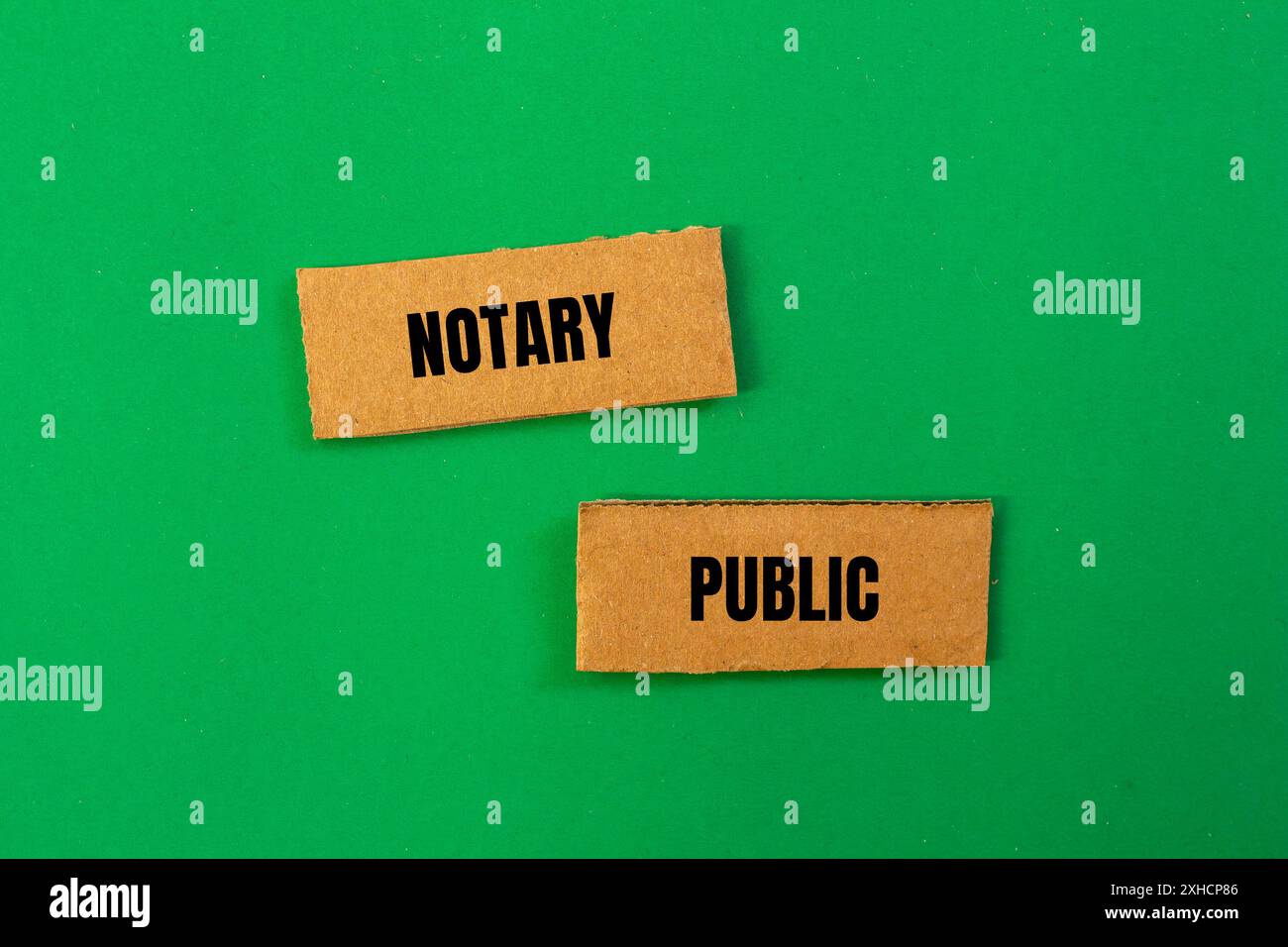 Notary public message written on ripped cardboard paper pieces with ...