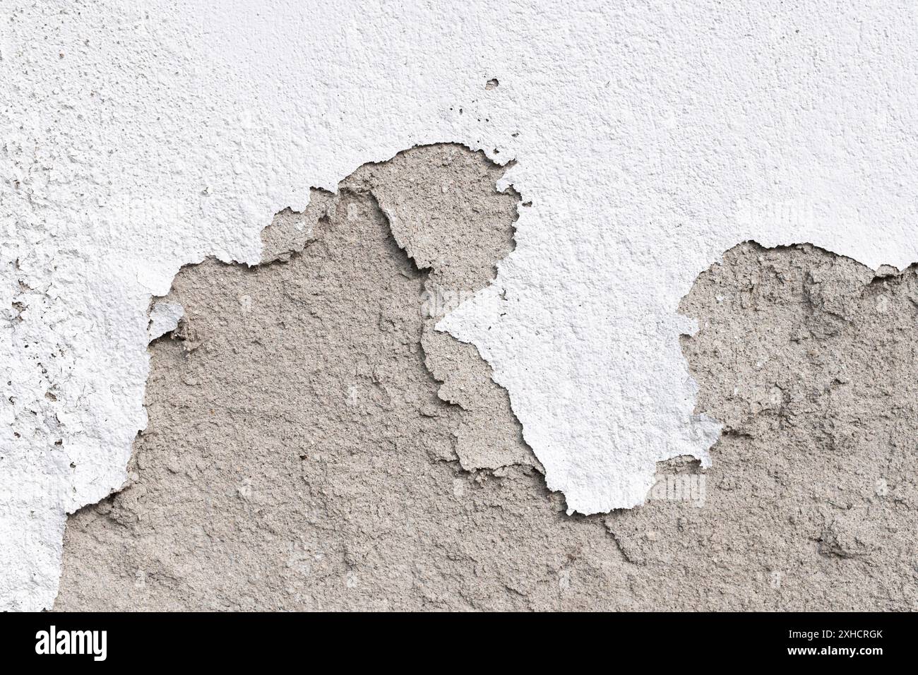 Wall damage on outdoor. Plaster and paint clog, surface damage. Peeled ...