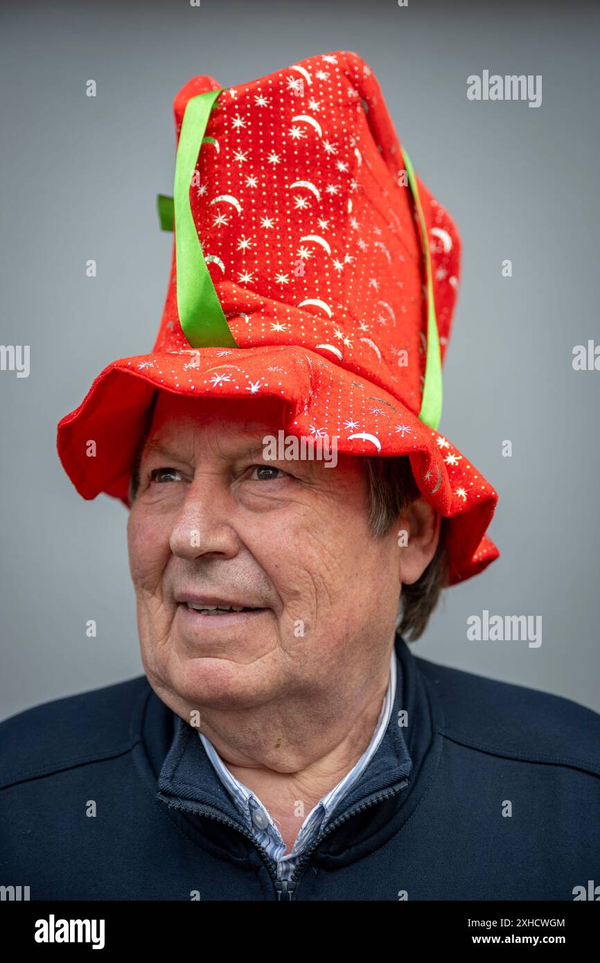 Chesham, UK. 13 July 2024. A visitor wearing a hat attends Hats Off ...
