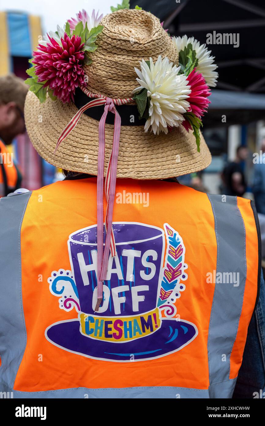 Chesham, UK. 13 July 2024. A staff member wearing a hat at Hats Off ...