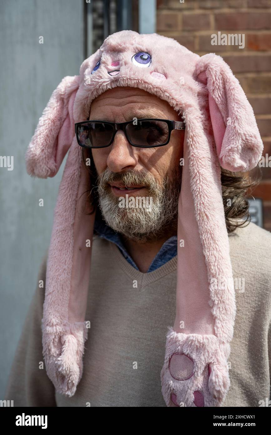 Chesham, UK. 13 July 2024. A visitor wearing a hat attends Hats Off ...