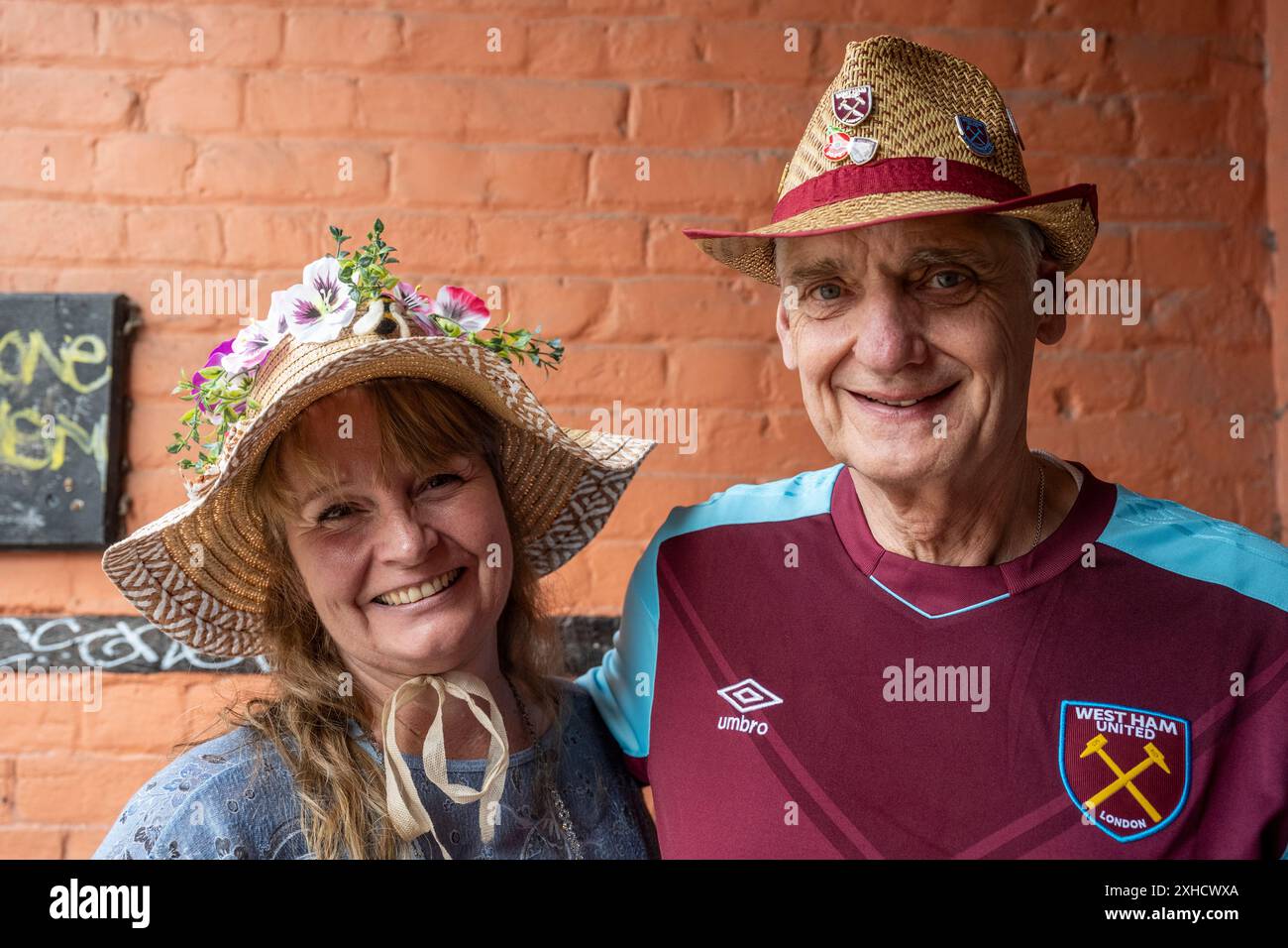 Chesham, UK. 13 July 2024. Visitors wearing hats attend Hats Off ...