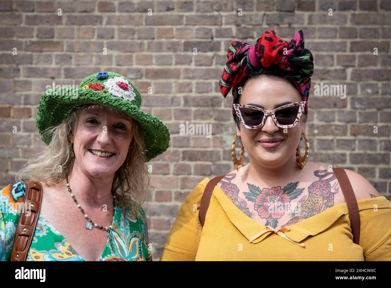 Chesham, UK. 13 July 2024. Visitors wearing hats attend Hats Off ...