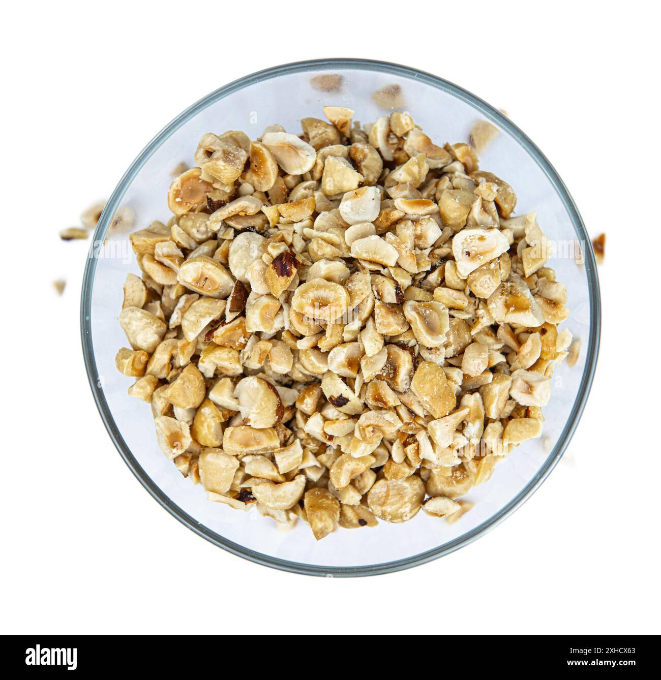 Freshly chopped Hazelnuts as detailed close up shot isolated on white ...