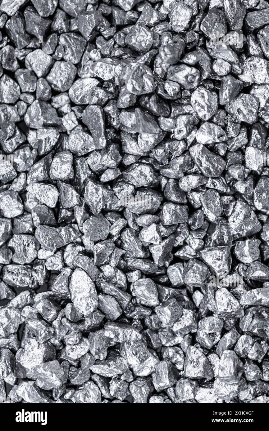 Heap of silver nuggets (close up shot) for use as background or texture ...
